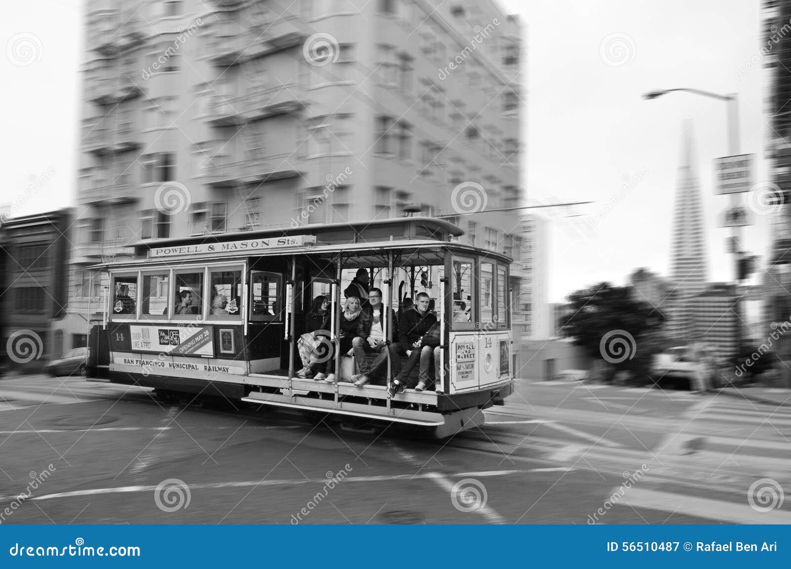 Passengers Riding On Cable Car No. 15 With Alcatraz Island In Th ...