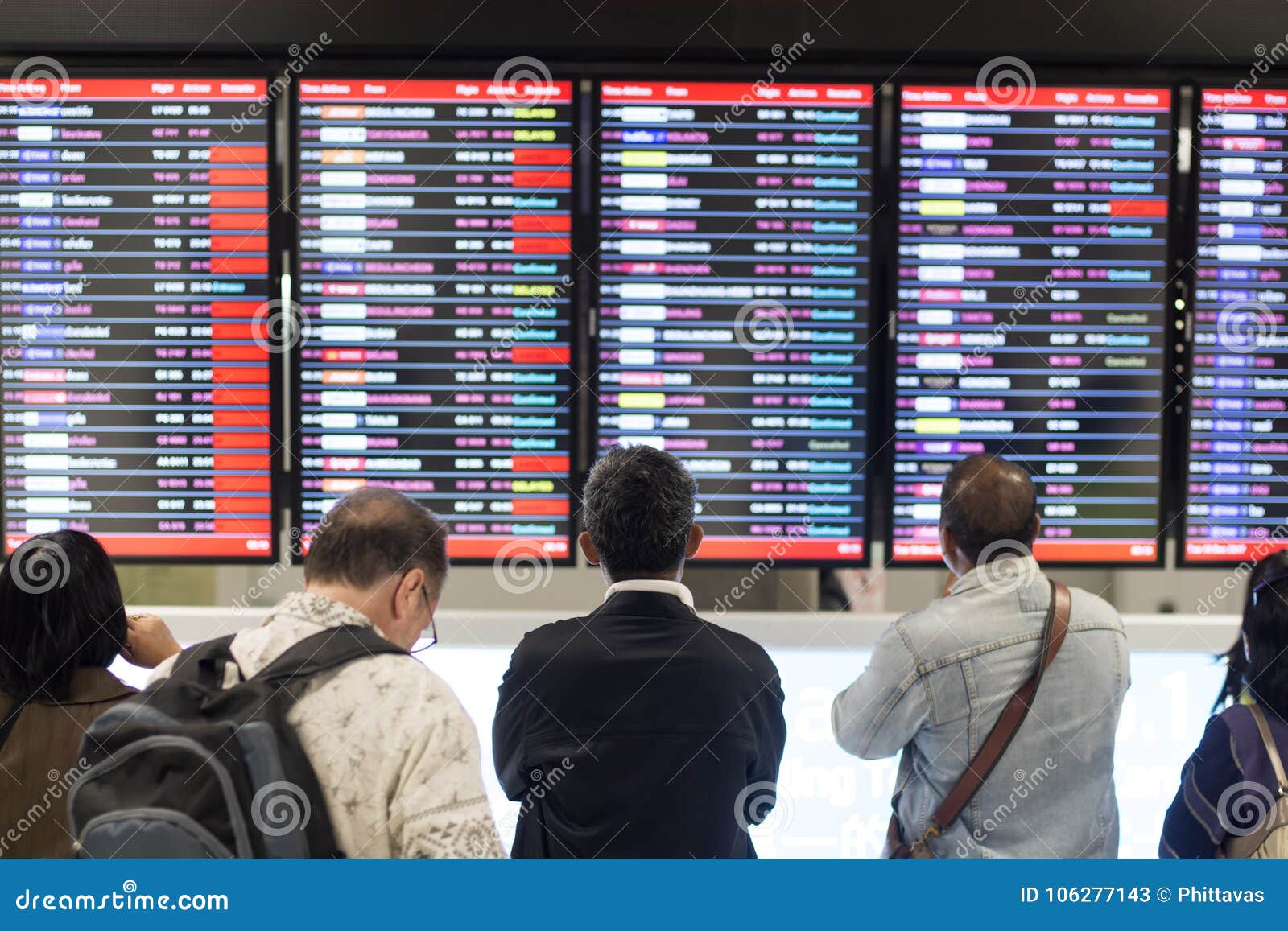 Passengers Standing in Front of Arrivals Board . Editorial Stock Photo ...