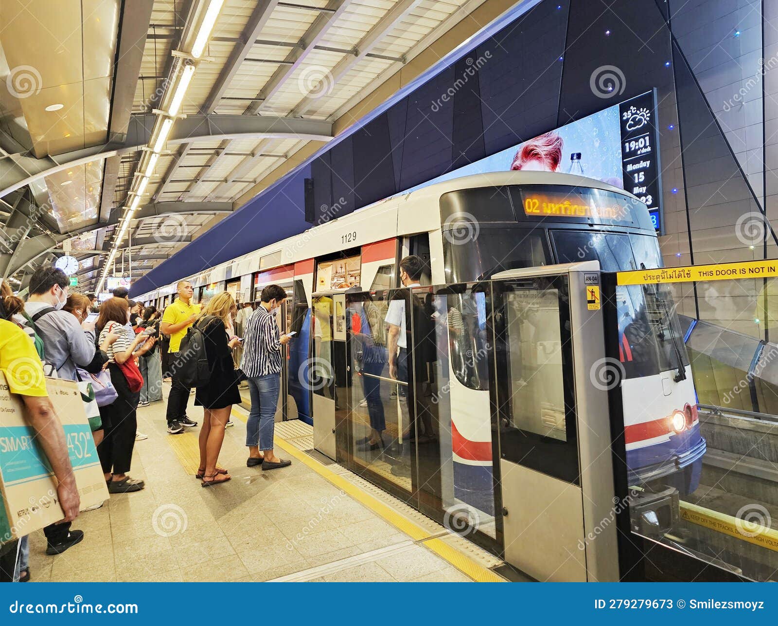 Passengers Wait for the BTS Skytrain, an Elevated Rapid Mass Transit ...