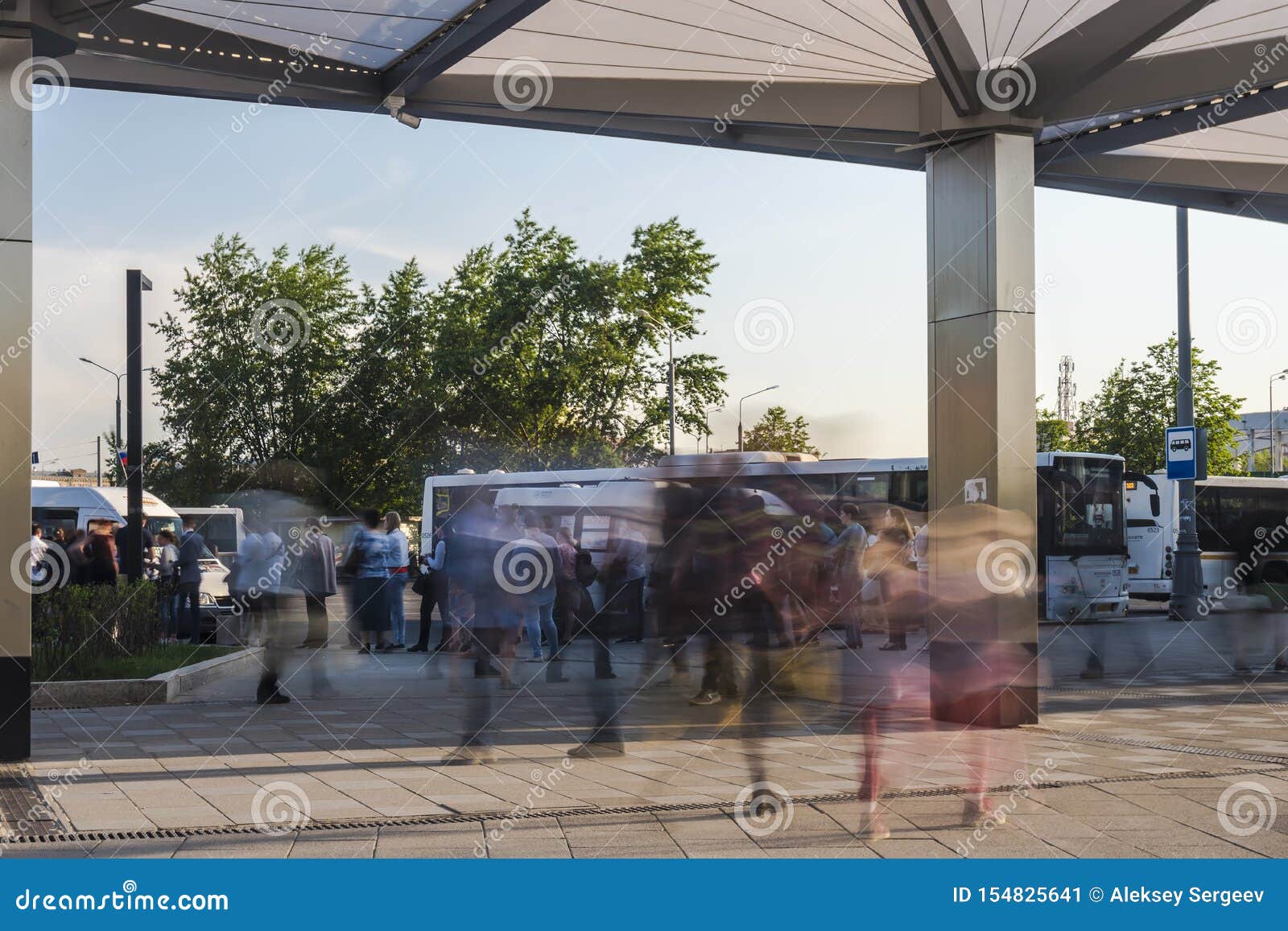 Passengers Waiting and Boarding Buses at the Bus Terminal Editorial ...