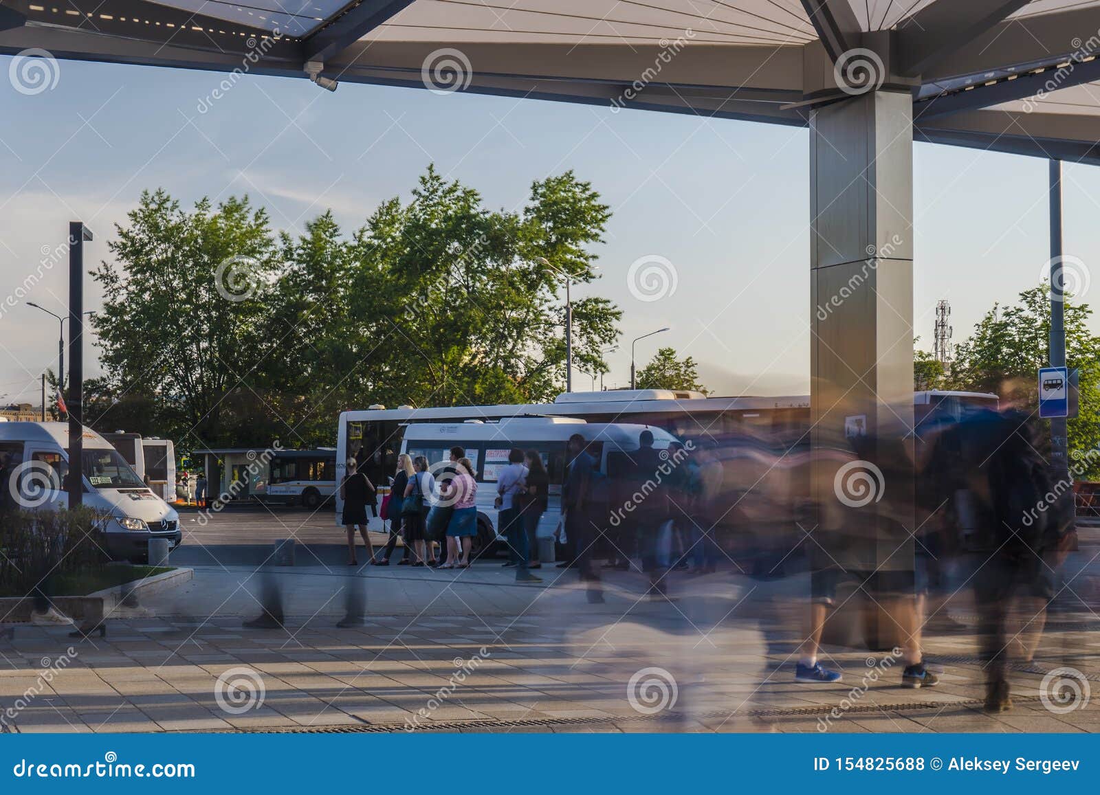 Passengers Waiting and Boarding Buses at the Bus Terminal Editorial ...