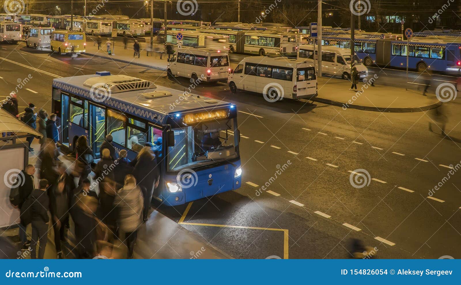 Passengers Waiting and Boarding Buses at the Bus Terminal Editorial ...
