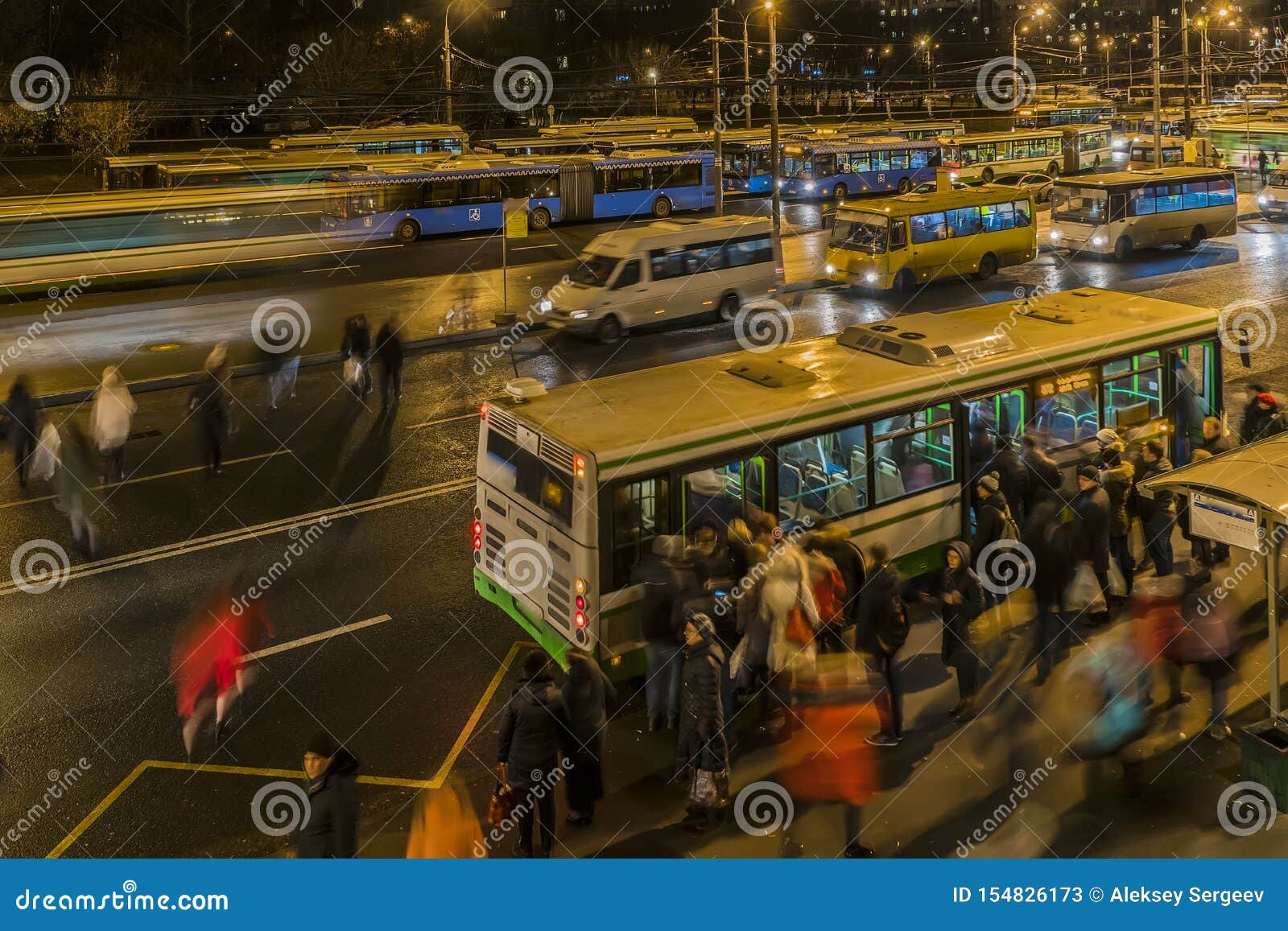 Passengers Waiting and Boarding Buses at the Bus Terminal Stock Image ...