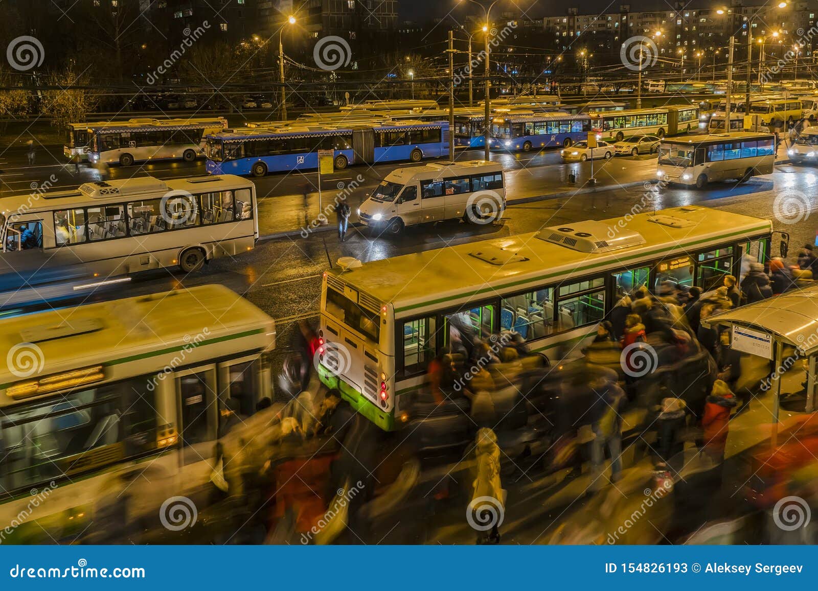 Passengers Waiting and Boarding Buses at the Bus Terminal Stock Image ...