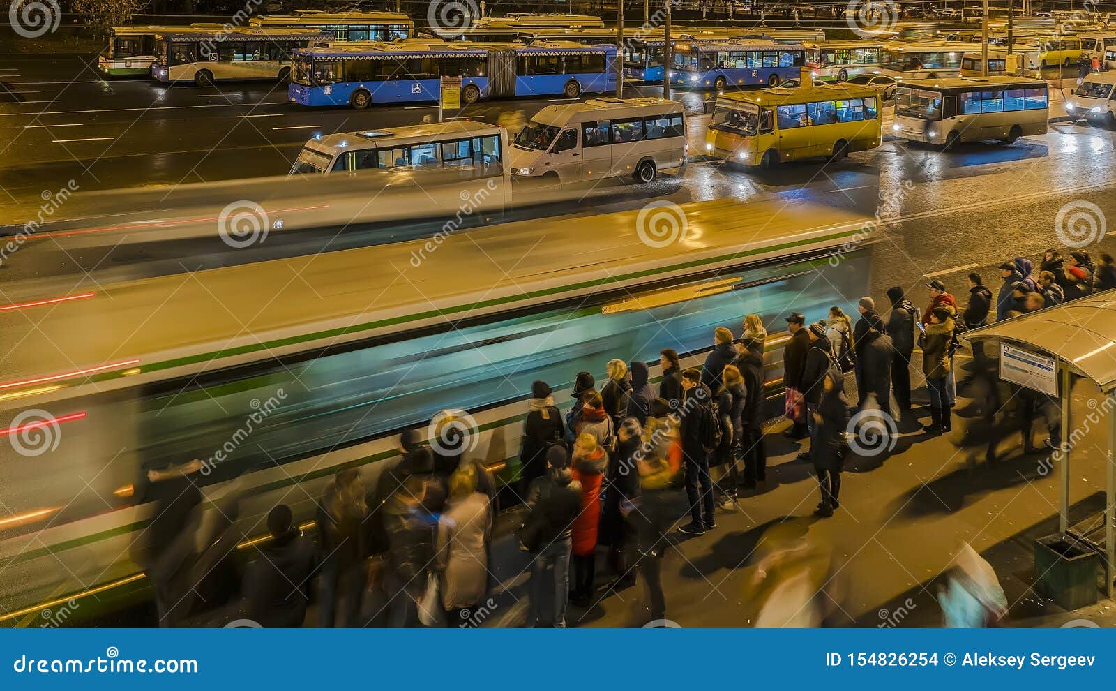 Passengers Waiting and Boarding Buses at the Bus Terminal Editorial ...
