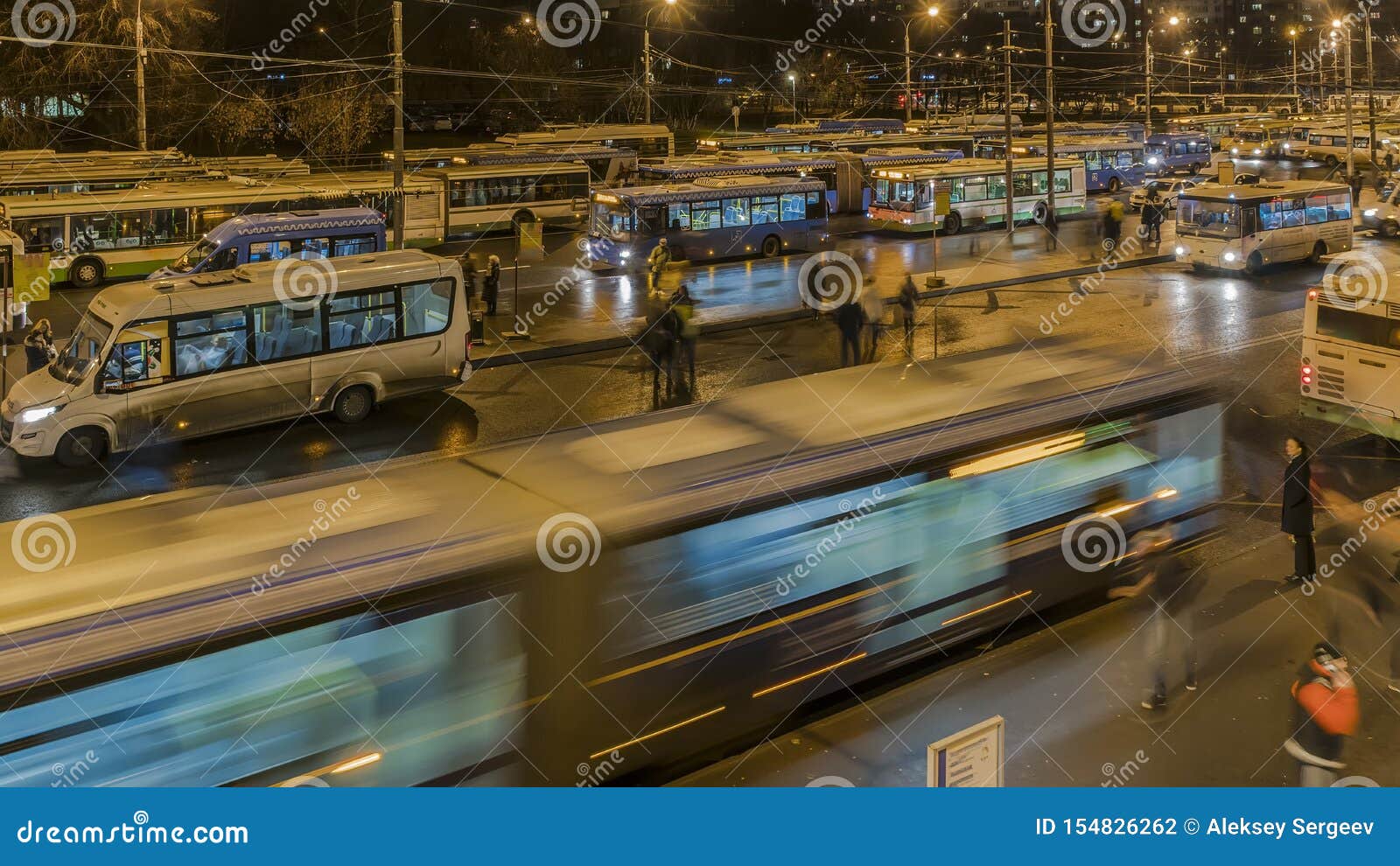 Passengers Waiting and Boarding Buses at the Bus Terminal Stock Photo ...