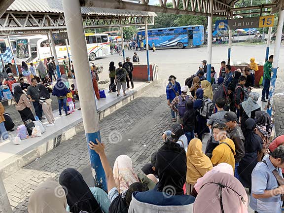 Passengers Waiting for the Bus at the Pool during Idul Fitri at the ... Passengers Waiting for the Bus at the Pool during Idul Fitri at the ...