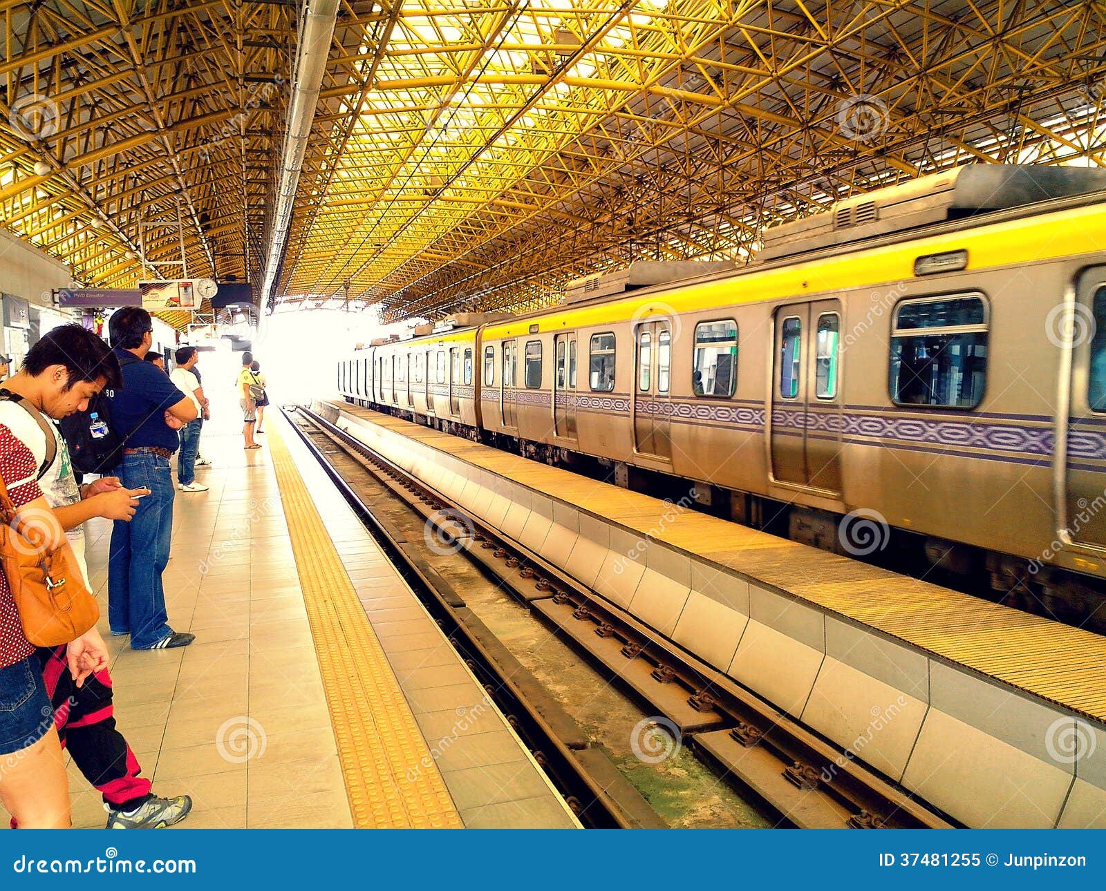 Passengers Waiting at a Train Station Editorial Image - Image of ...