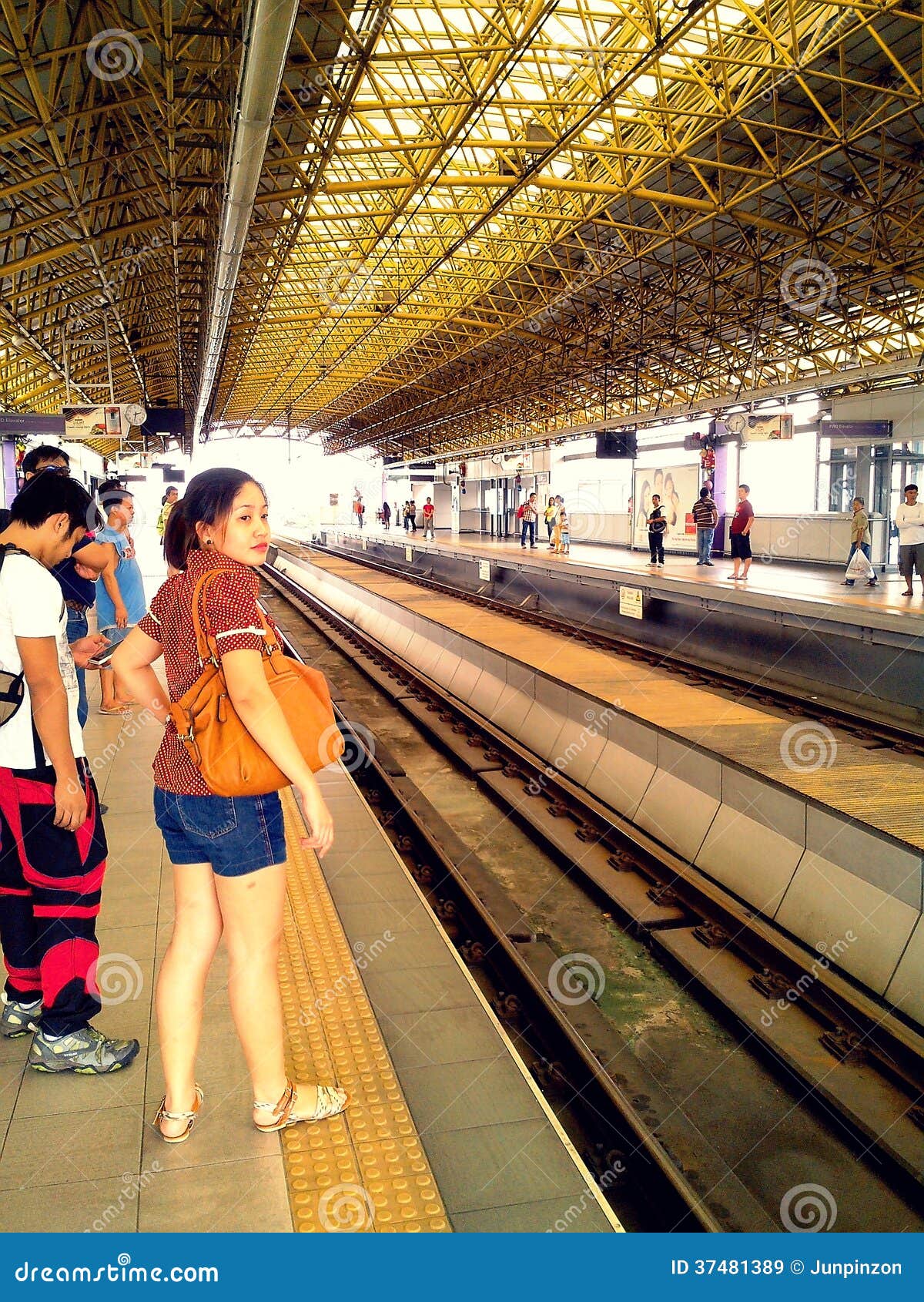 Passengers Waiting at a Train Station Editorial Stock Image - Image of ...