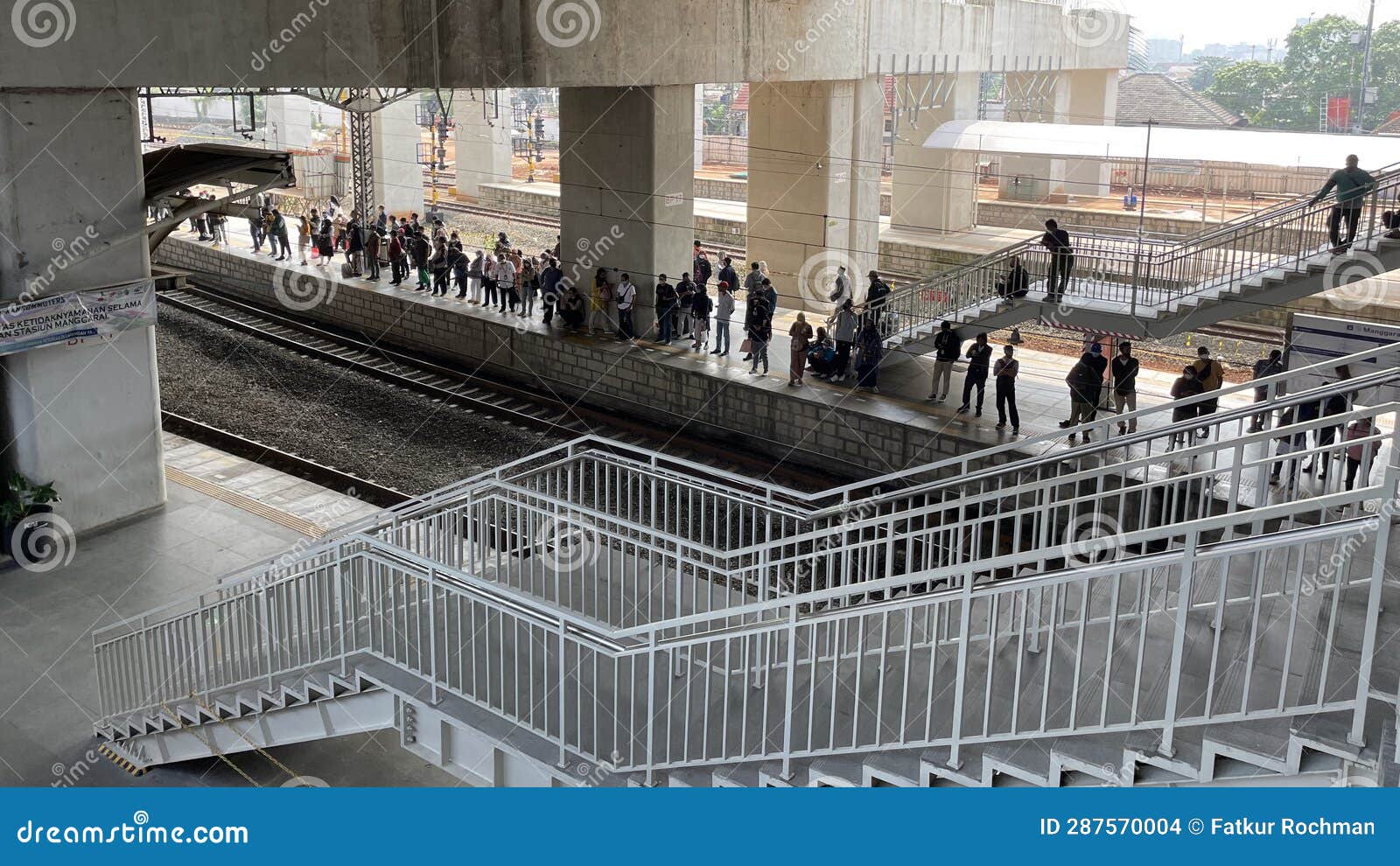 Passengers Waiting for the Train on the Station Platform with Pillars ...