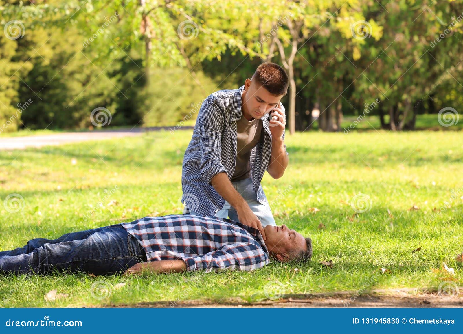 Passerby Calling Ambulance while Checking Pulse Stock Photo - Image of ...