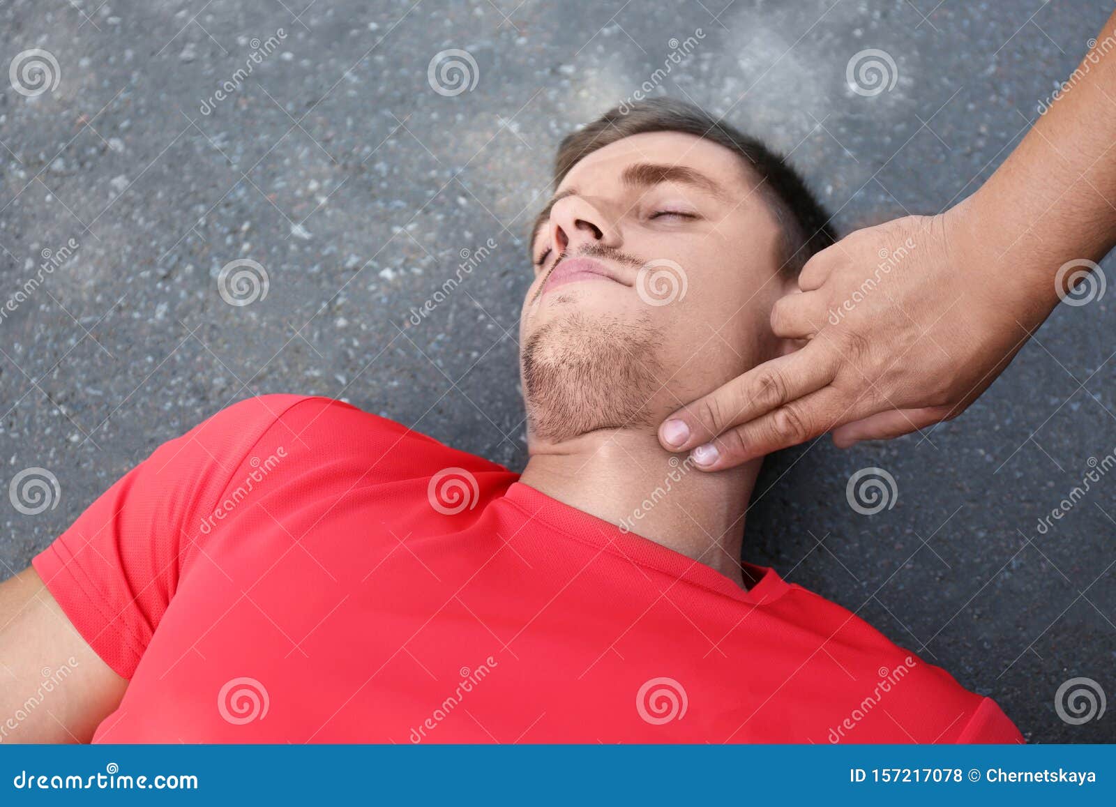 Passerby Checking Pulse of Unconscious Man Outdoors Stock Photo - Image ...