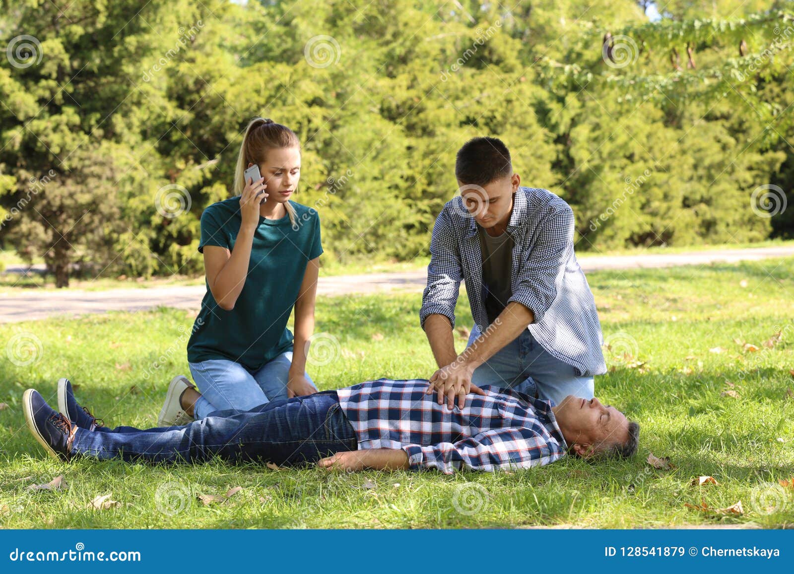 Passersby Helping Unconscious Man Outdoors Stock Image - Image of ...