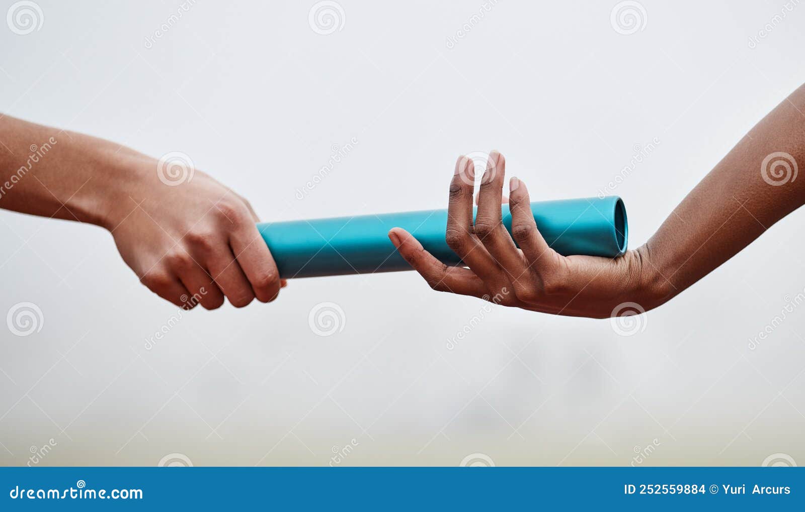 Passing the Baton To Future Generations. Two Athletes Passing a Baton ...