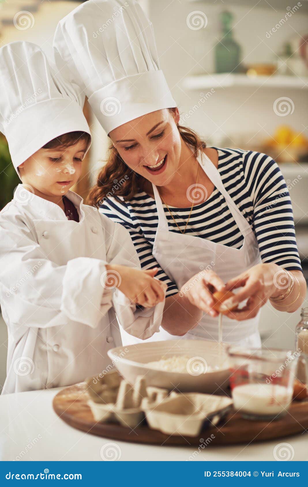 Passing on Her Love of Baking. a Mother and Her Young Son Baking ...
