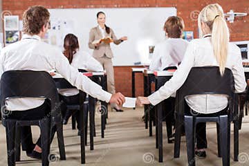 Passing note in classroom stock image. Image of beautiful - 27208275
