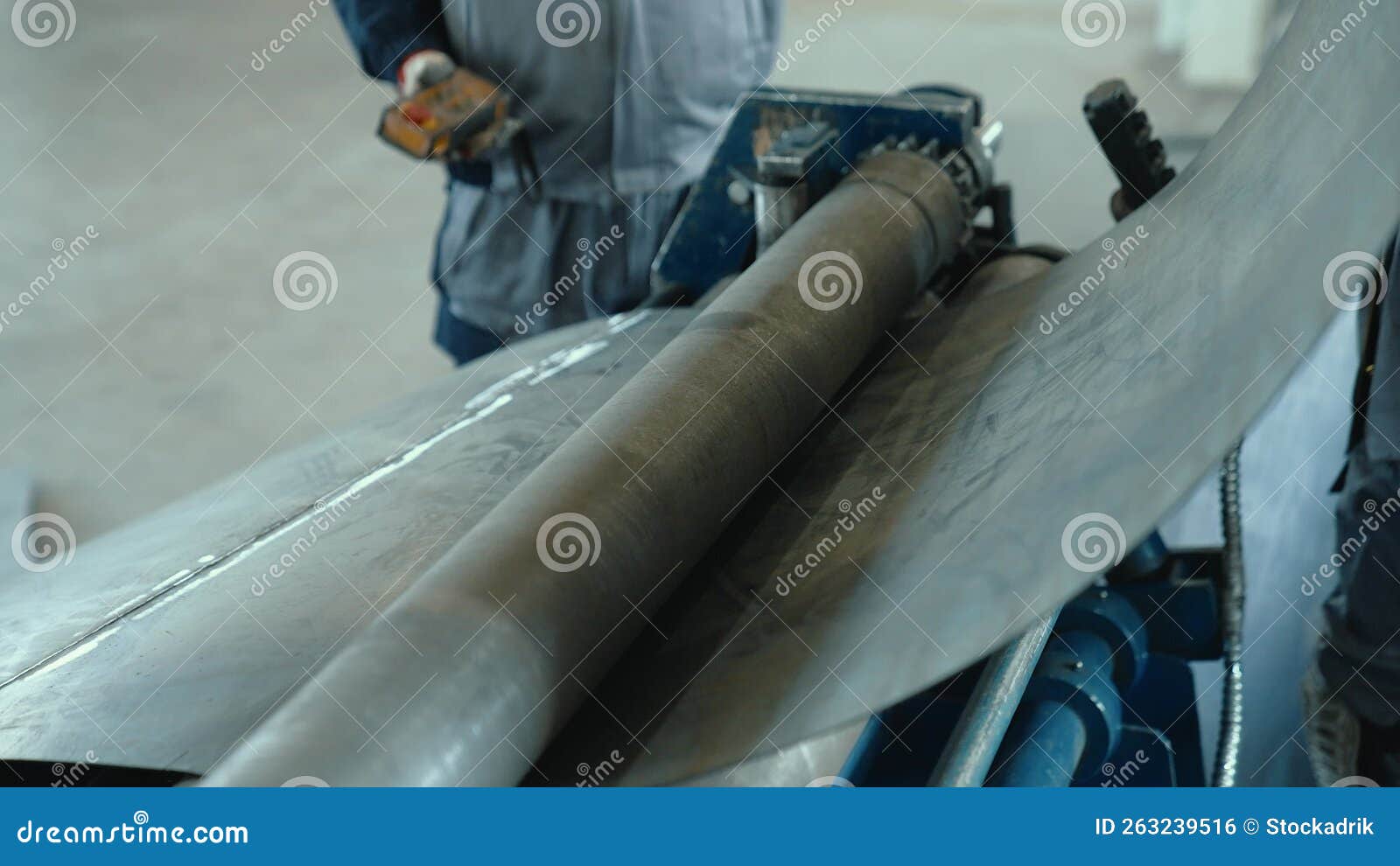 Passing a Sheet of Metal through a Round Shaft. Metal Rolling Machine ...