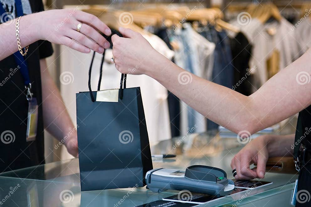 Passing the shopping bag stock image. Image of hold, electronic - 10210969