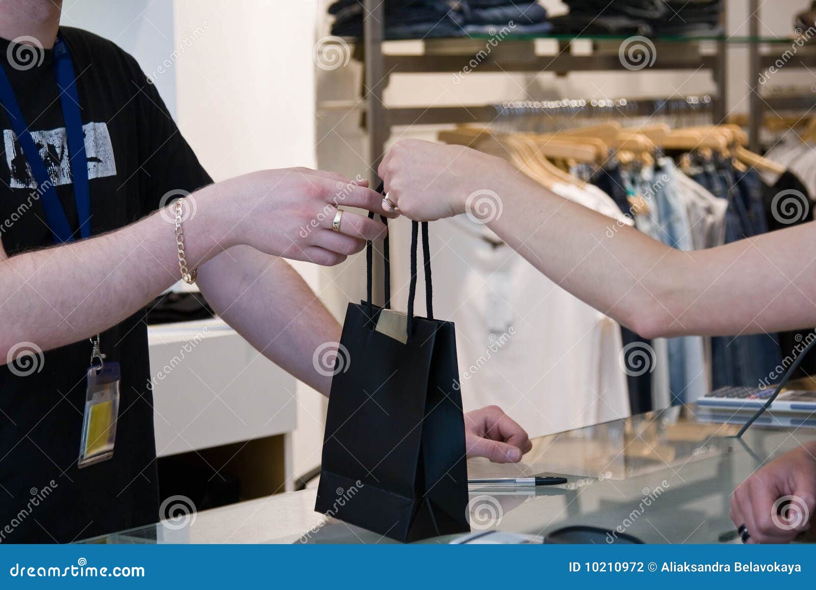 Passing the shopping bag stock photo. Image of passing - 10210972