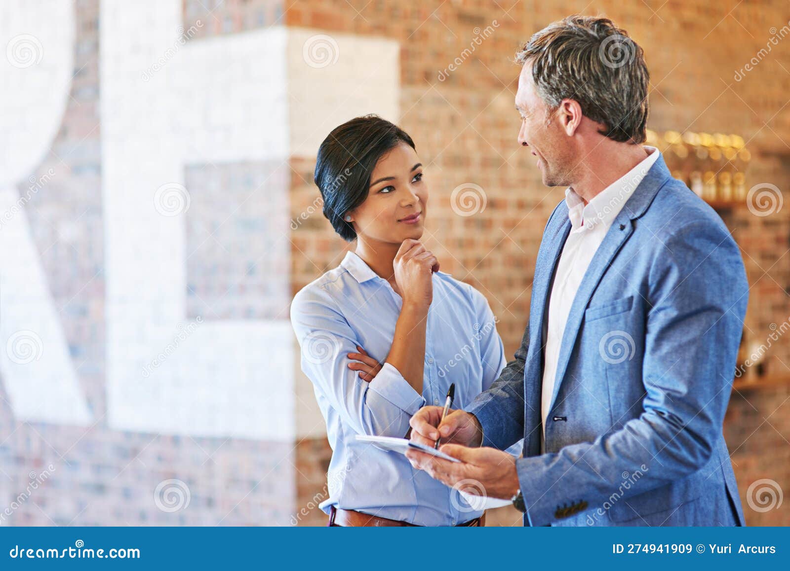 Passing on Some of His Experience. a Coworkers Talking Together Over a ...