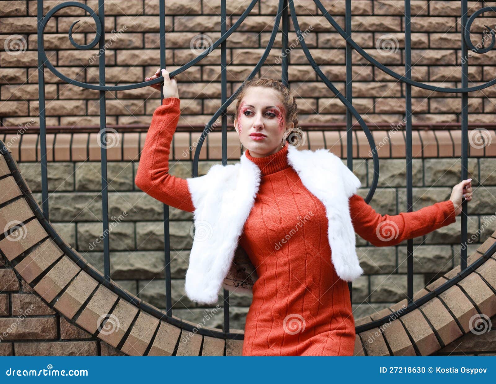 Passion Girl in Orange Pose on Iron Fence Stock Photo - Image of ...