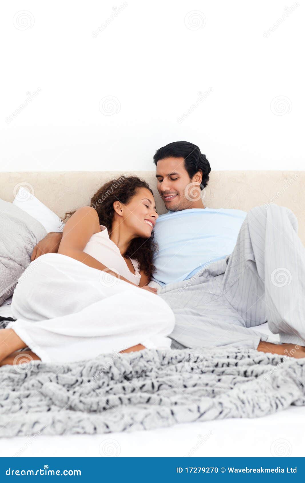 Passionate Couple Lying Together on Their Bed Stock Photo - Image of ...