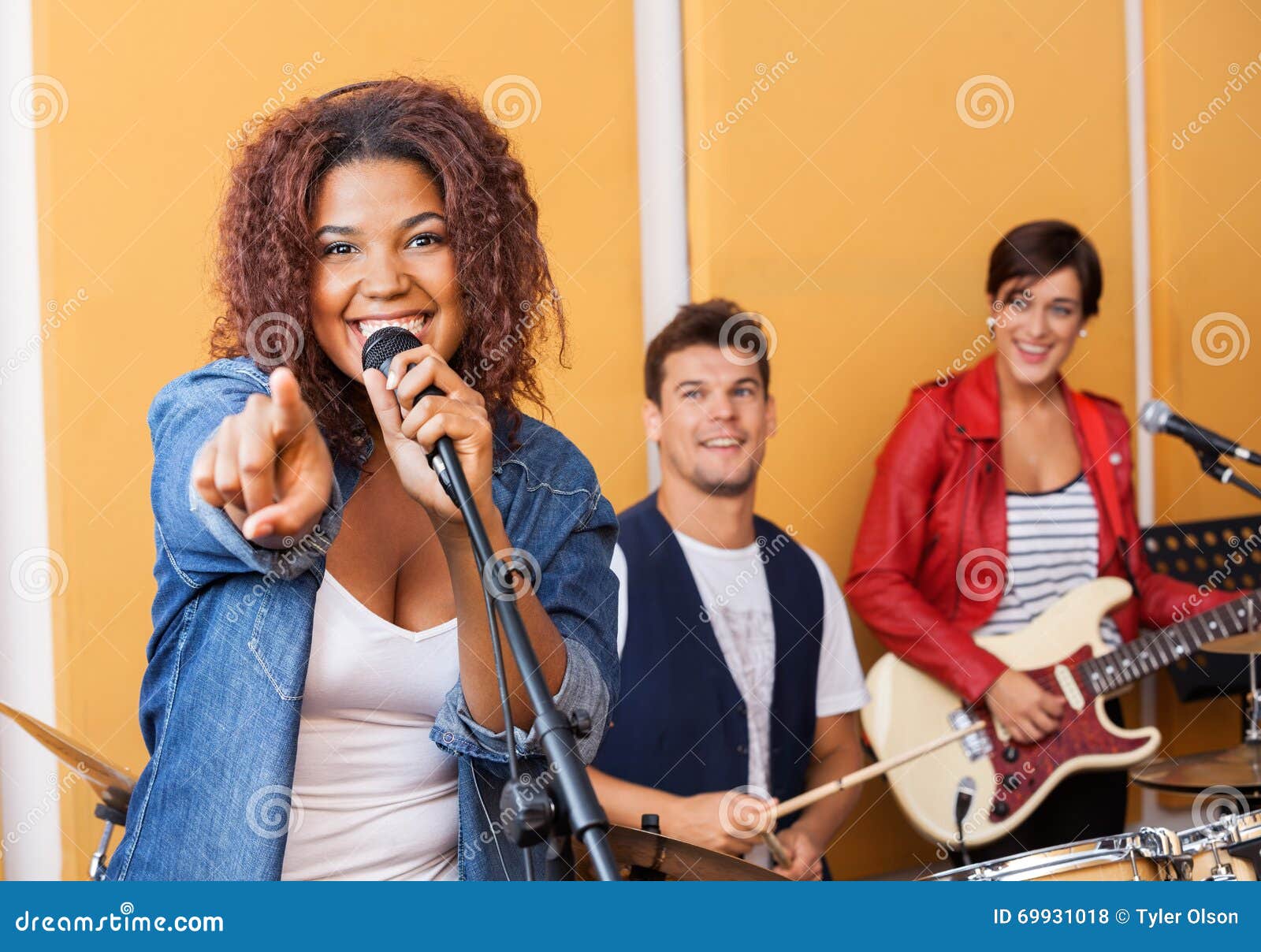 Passionate Singer Pointing while Performing in Recording Studio Stock ...
