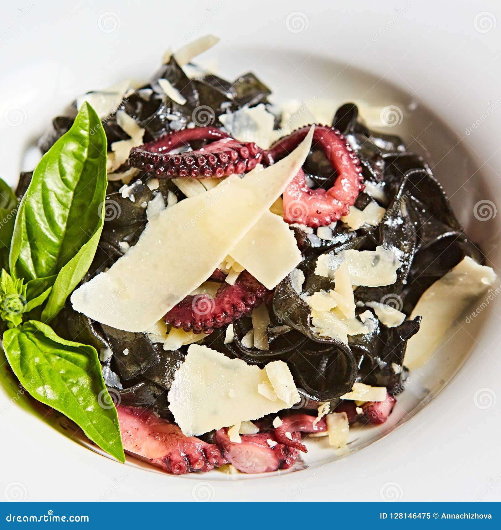 Pasta with Black Cuttlefish Ink, Octopuses and Parmesan. Stock Image ...