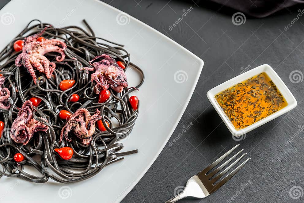 Pasta with Black Cuttlefish Ink and Small Octopuses Stock Image - Image of germ, noodle: 48043357