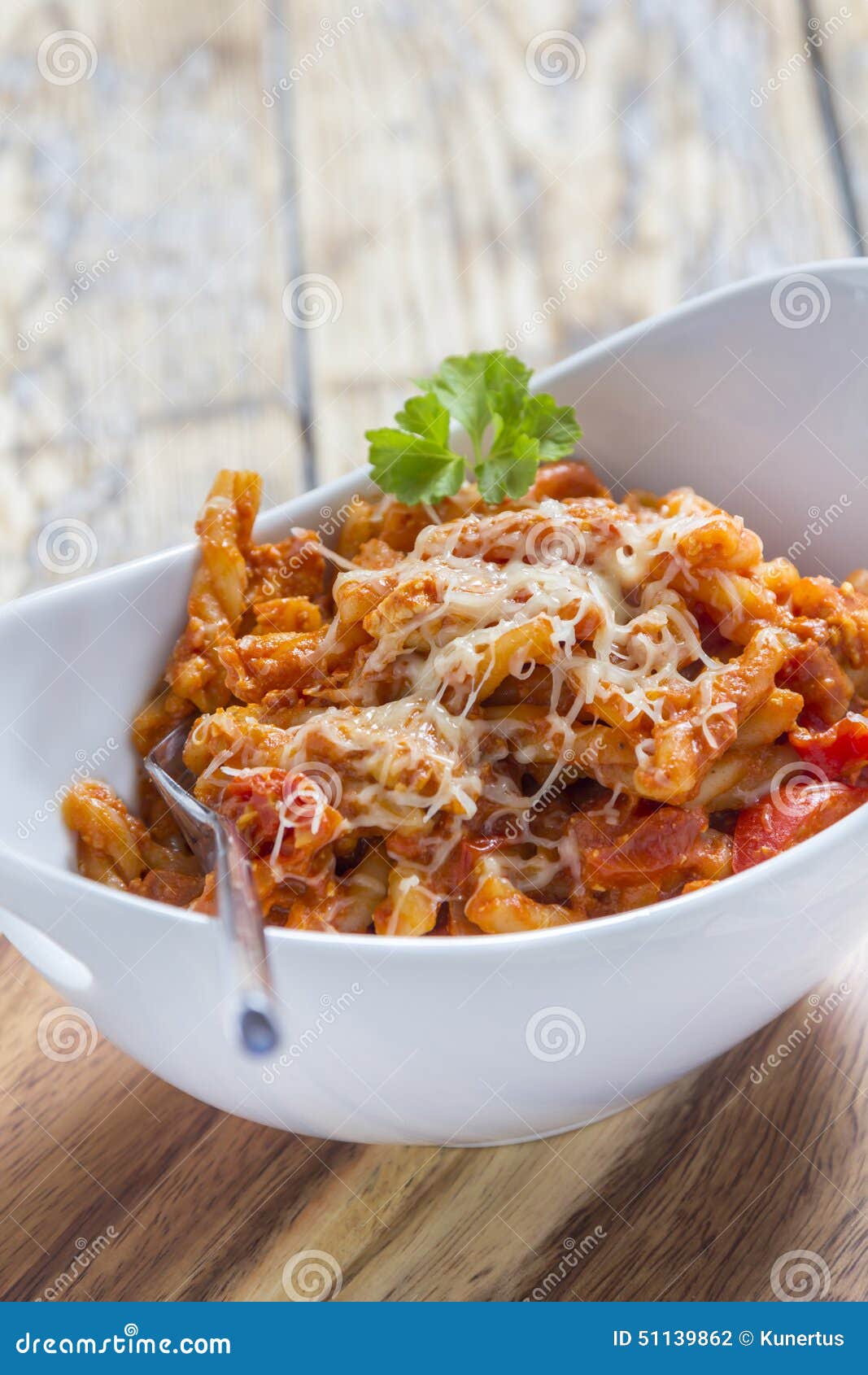 Pasta in a bowl stock photo. Image of plate, wooden, ingredient - 51139862