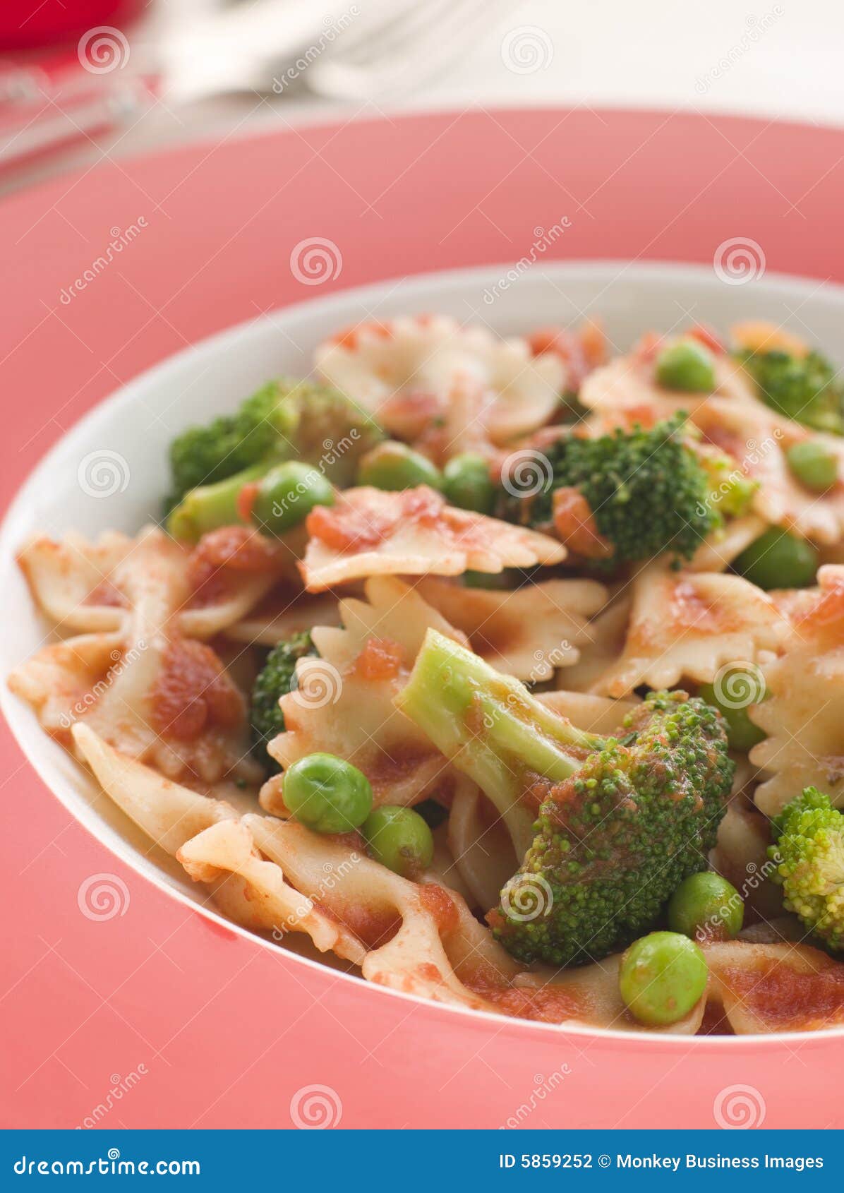 Pasta Bows with Tomato Sauce Broccoli and Peas Stock Photo - Image of ...