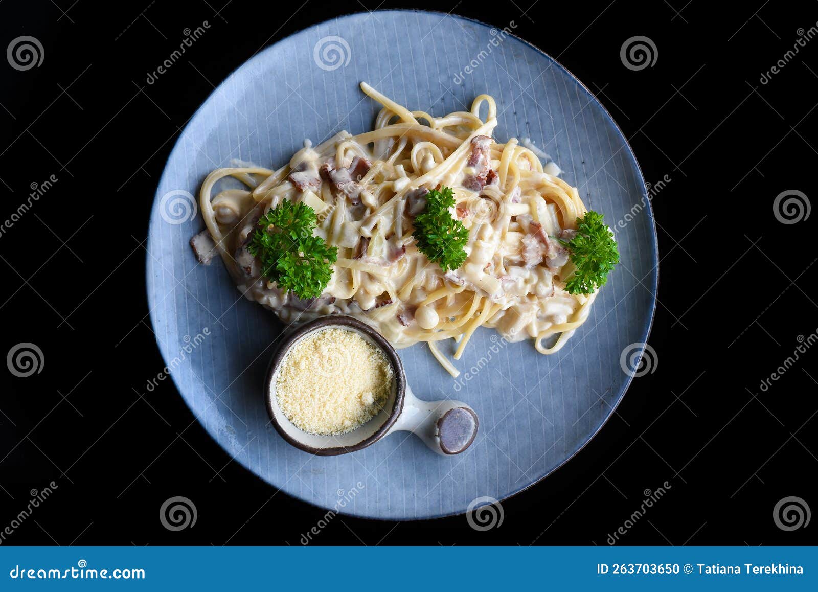 Pasta Carbonara with Bacon on Blue Plate Isolated on Black Background ...