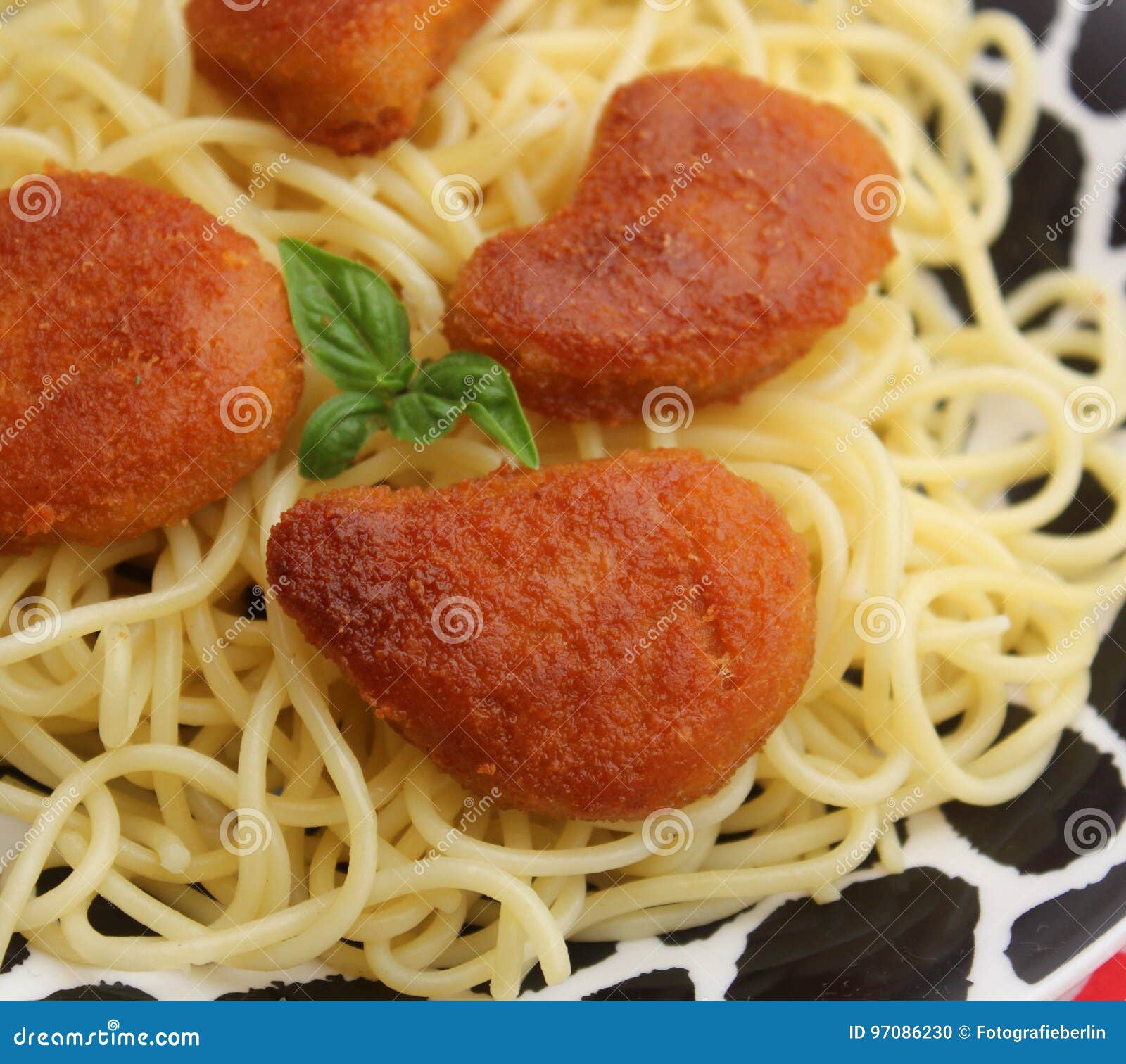 Pasta with chicken nuggets stock photo. Image of cooked - 97086230