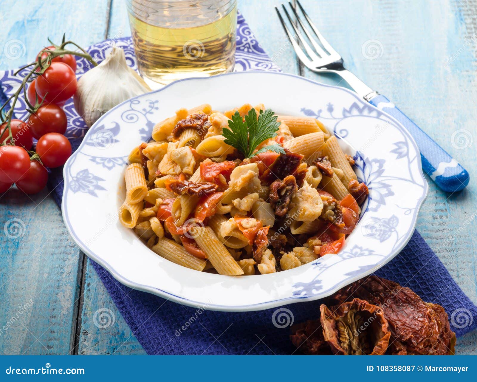 Pasta with fish ragout stock image. Image of basil, garnish - 108358087