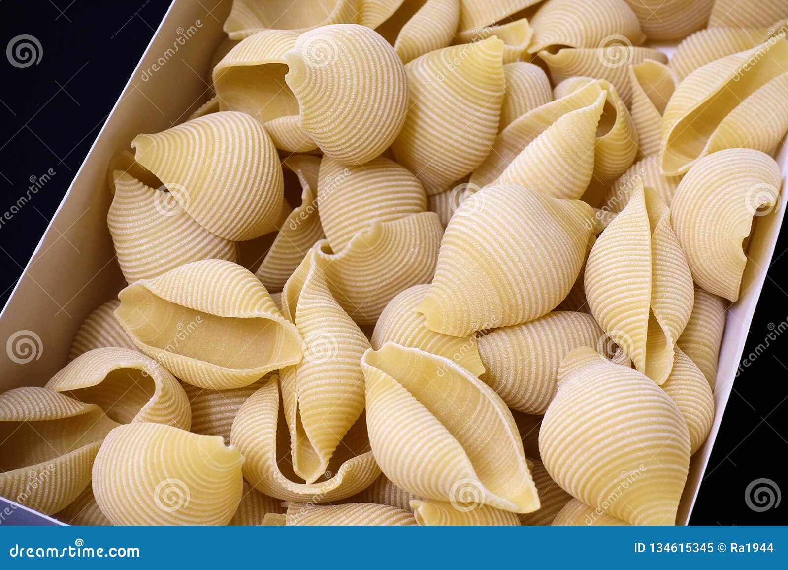 Pasta in the Form of Shells Close-up. Culinary Background Stock Image ...