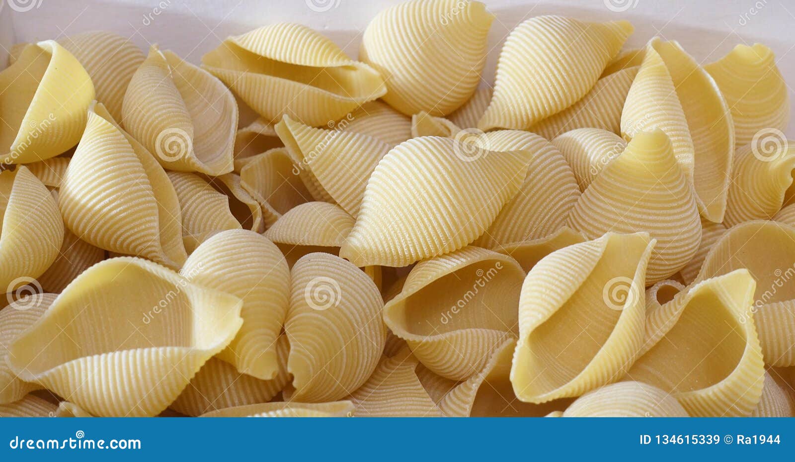 Pasta in the Form of Shells Close-up. Culinary Background Stock Image ...