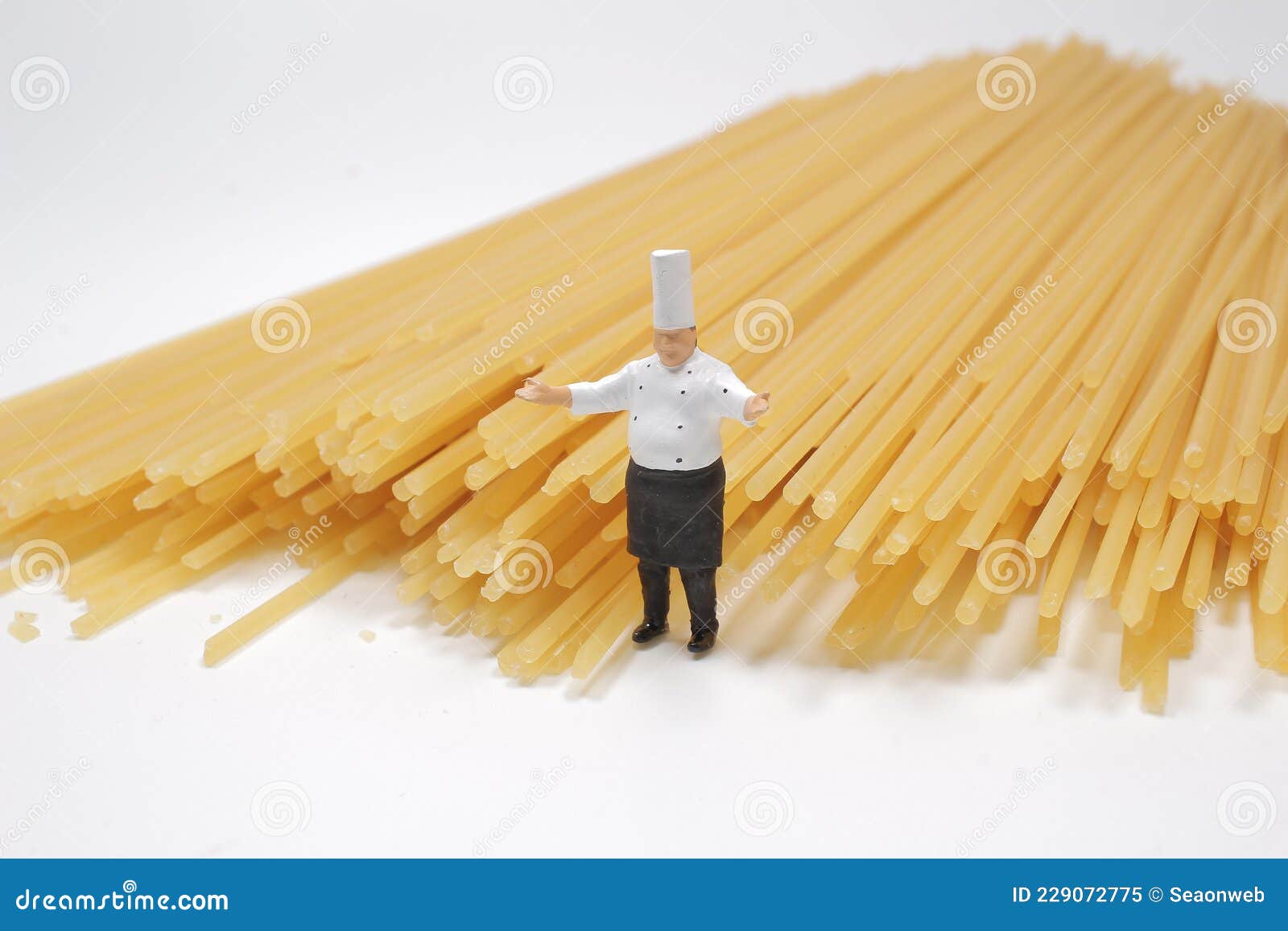 A Pasta and a Mini Chef Figure Stock Image - Image of carbohydr, tower ...
