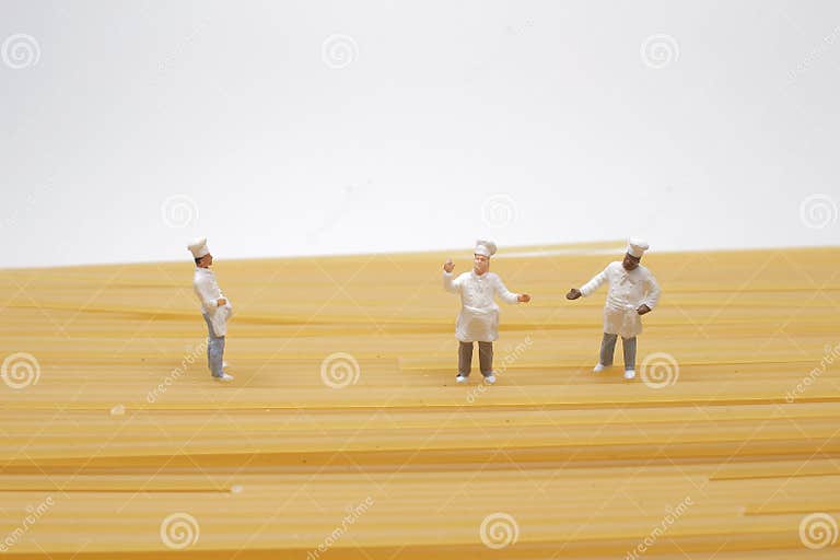 The Pasta and a Mini Chef Figure Stock Photo - Image of lunch, isolated ...