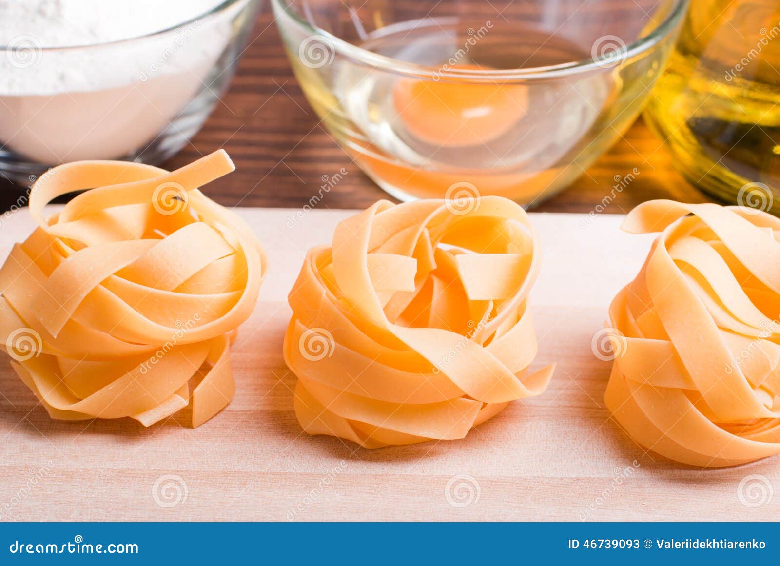 Pasta Raw Three Circles in a Row on a Small Cutting Board Light Stock ...