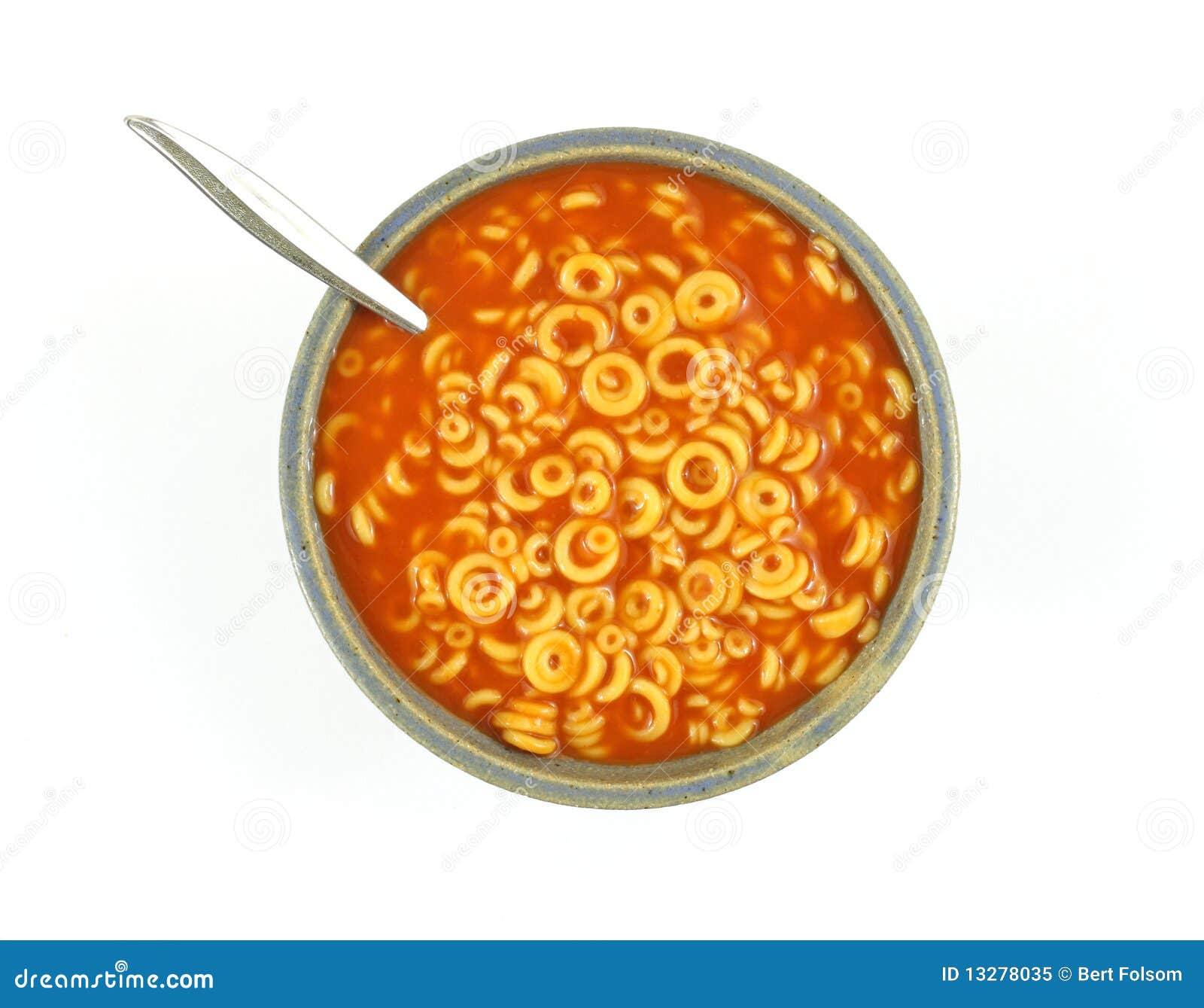Pasta Rings with Tomato Sauce and Spoon in Bowl Stock Image - Image of ...