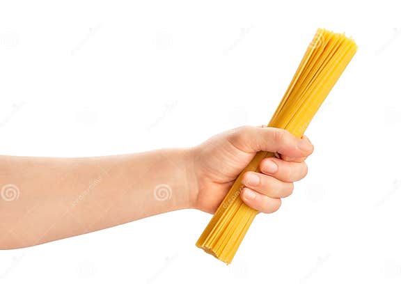 Pasta spaghetti in hand stock photo. Image of nutrition - 328709514