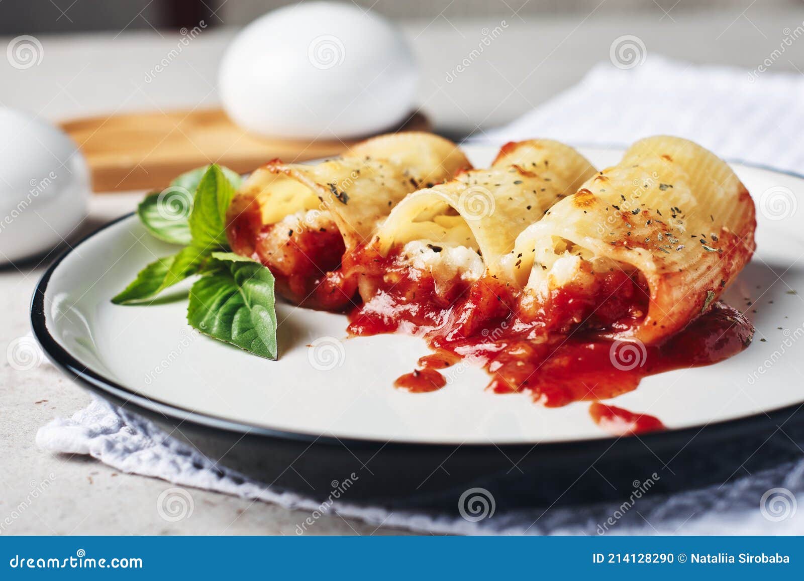Pasta Stuffed with Cheese and Fish in Tomato Sauce Stock Photo - Image ...