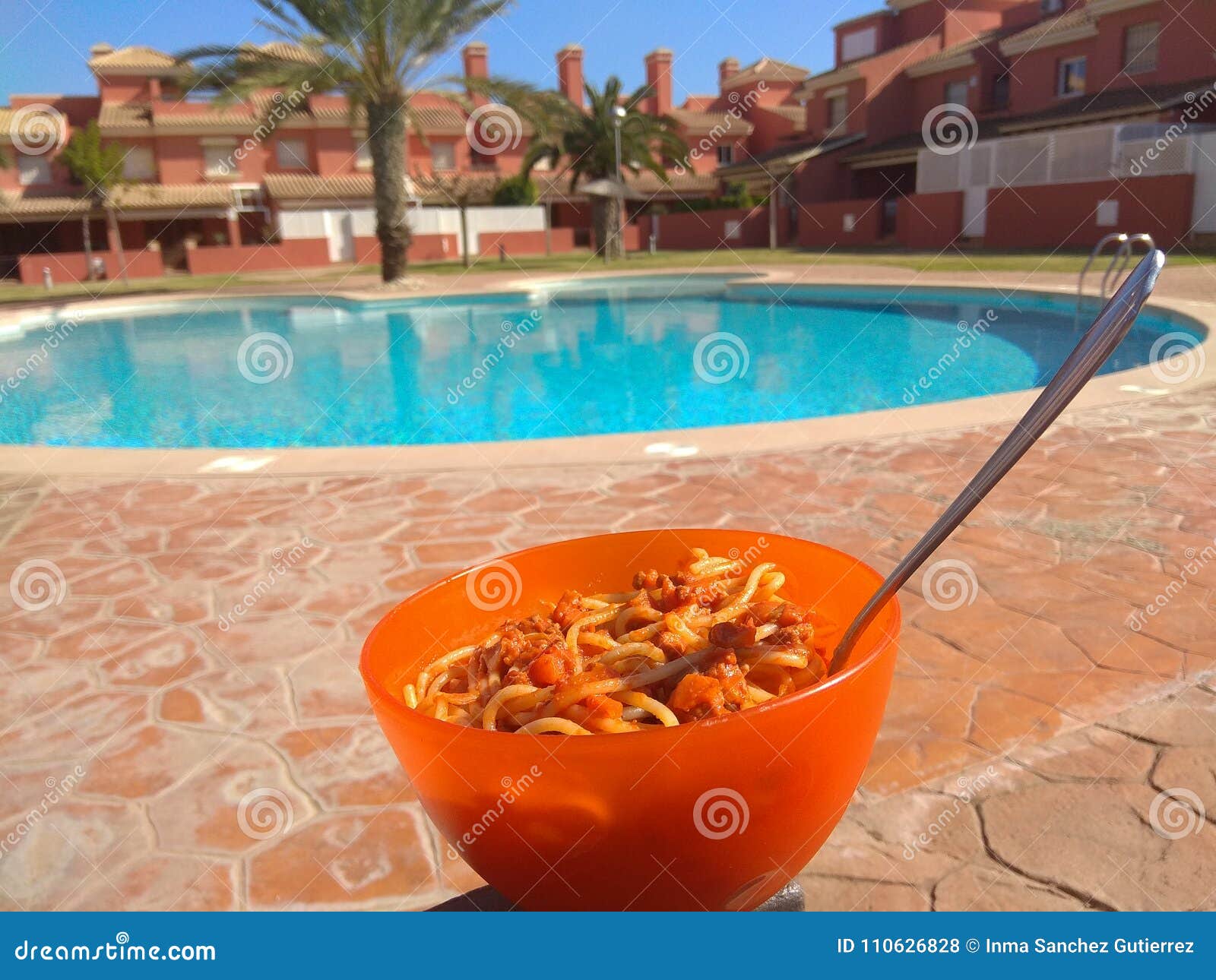 Pasta by the swimming pool stock photo. Image of views - 110626828