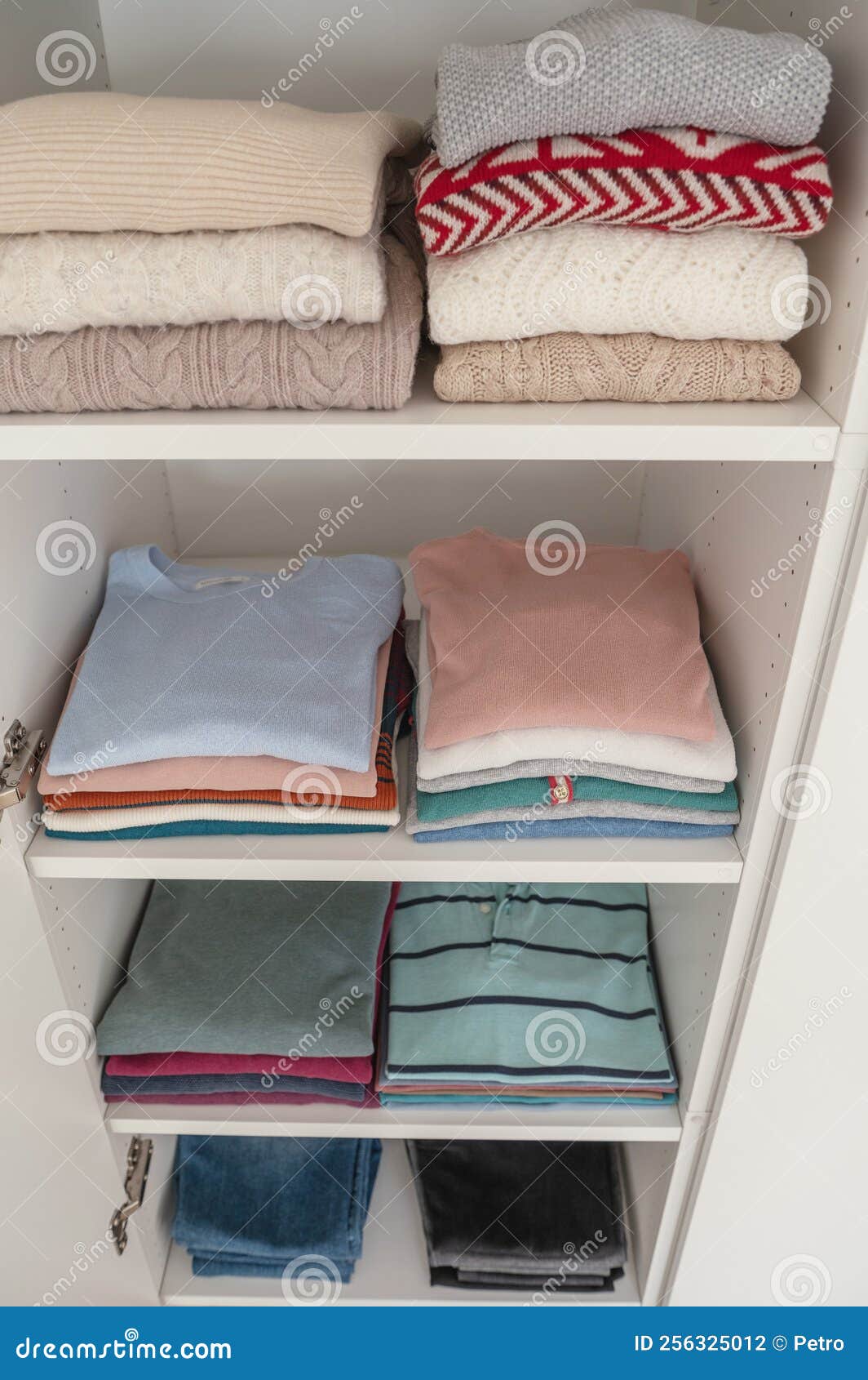 Pastel Clothes Folded on Shelves in Wardrobe Stock Photo - Image of ...
