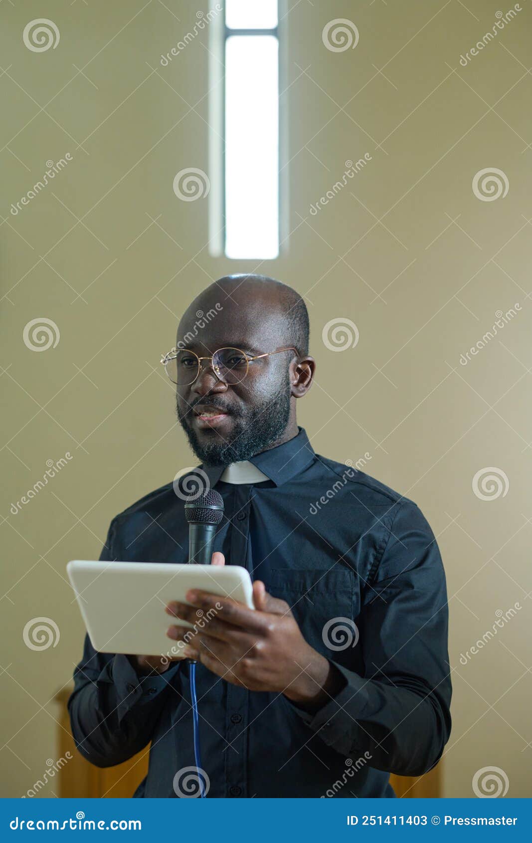 Pastor with Tablet Using Electronic or Online Bible while Pronouncing ...