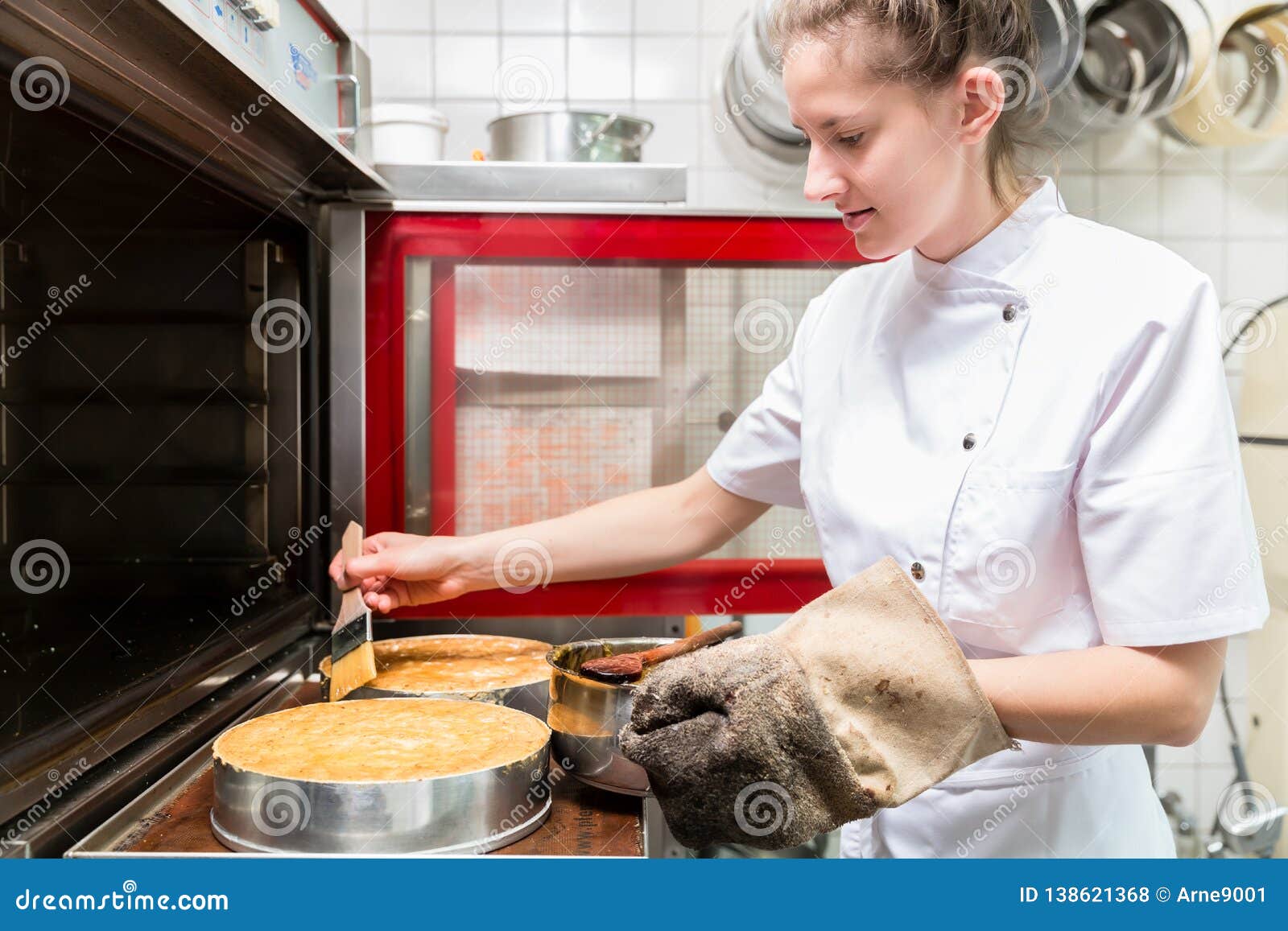 Pastry Baker Putting Pies or Cakes in Oven Stock Photo - Image of making, sweet: 138621368