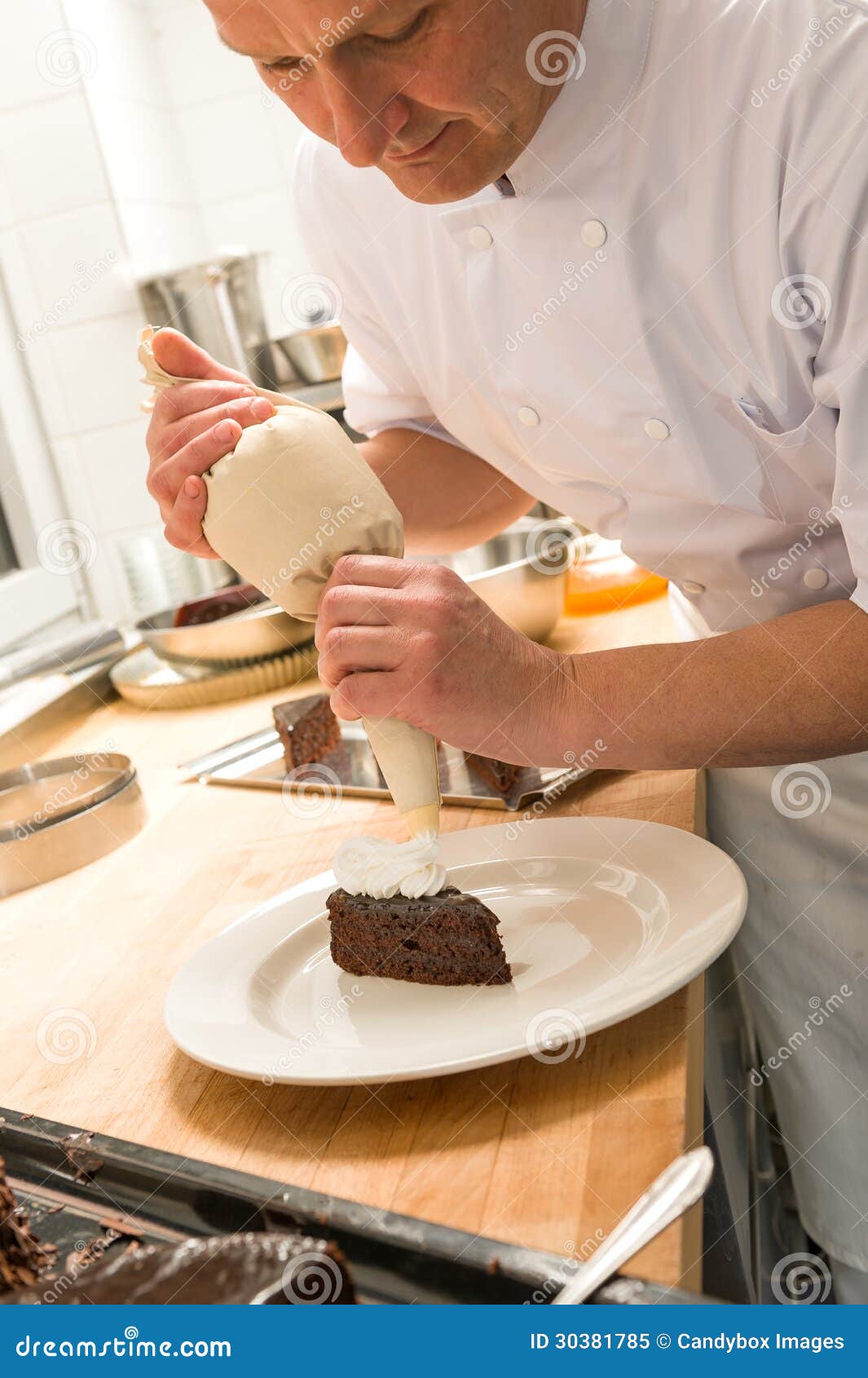 Pastry Chef Decorating Cake with Frosting Stock Image - Image of ...