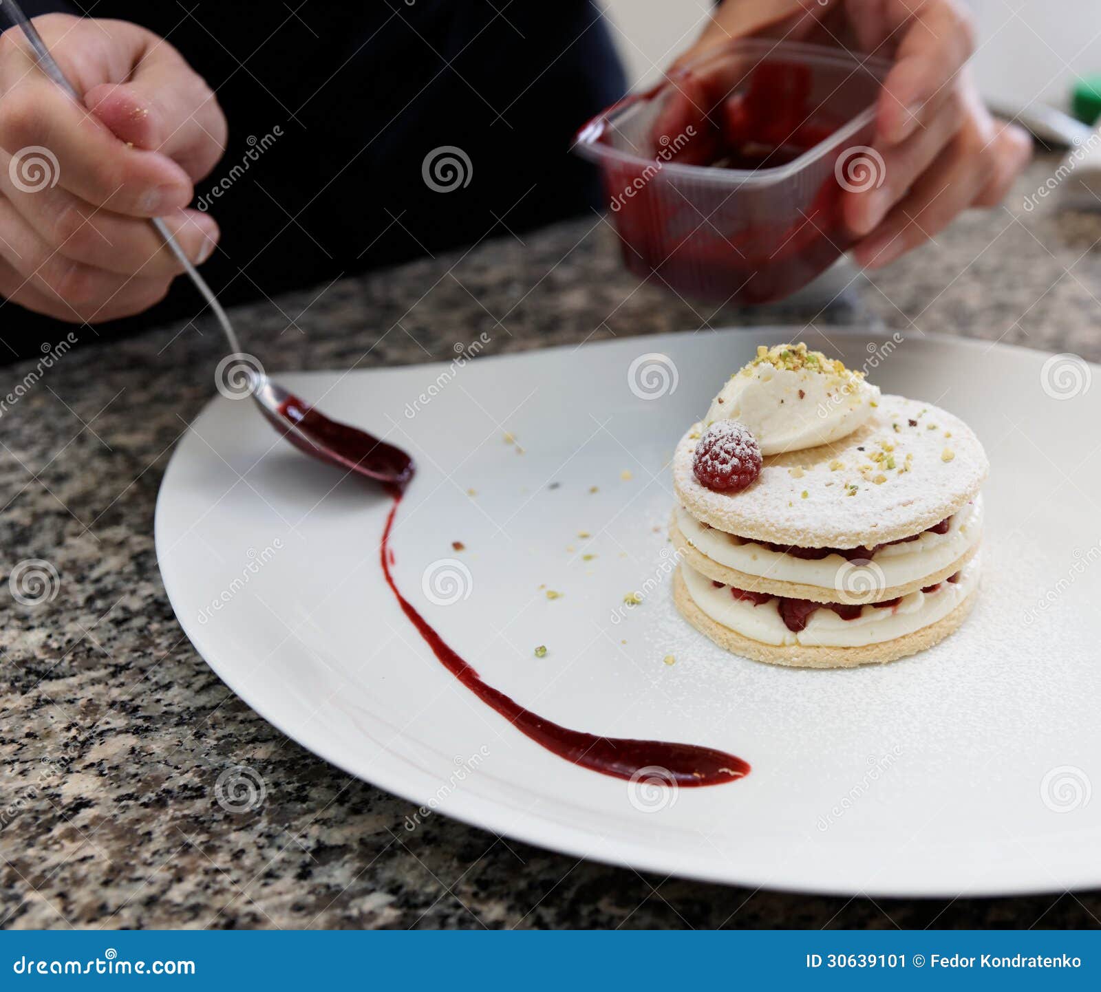 Pastry Chef is Decorating the Dessert with Berry Sauce Stock Image ...