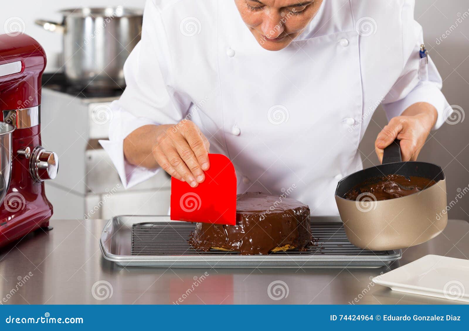 Pastry chef in the kitchen stock photo. Image of female - 74424964