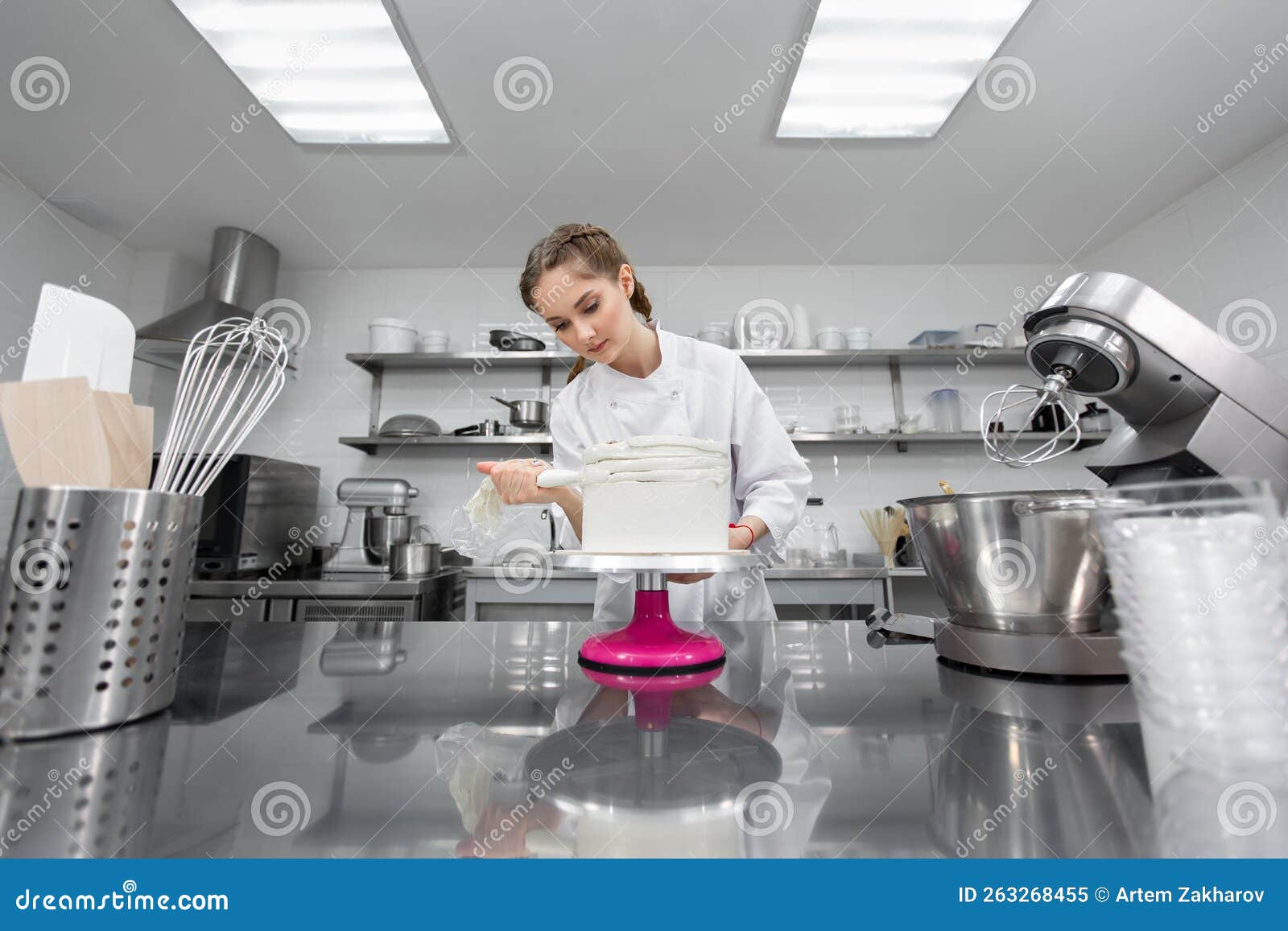 The Pastry Chef Levels the Cake with Cream. Stock Image - Image of ...